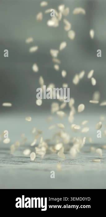 Falling sesame seeds on the table. Filmed is slow motion 1000 fps. High ...