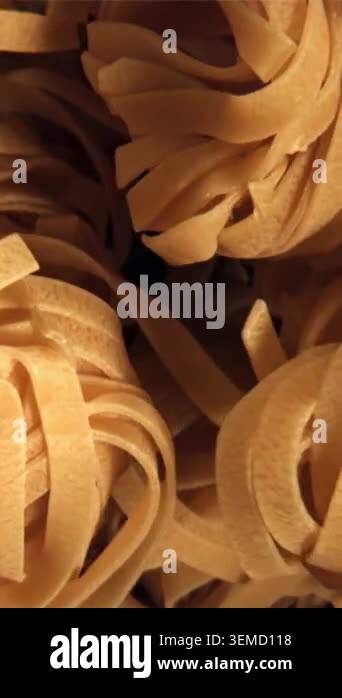 The tagliatelle pasta flies up. Filmed on a high-speed camera at 1000 ...