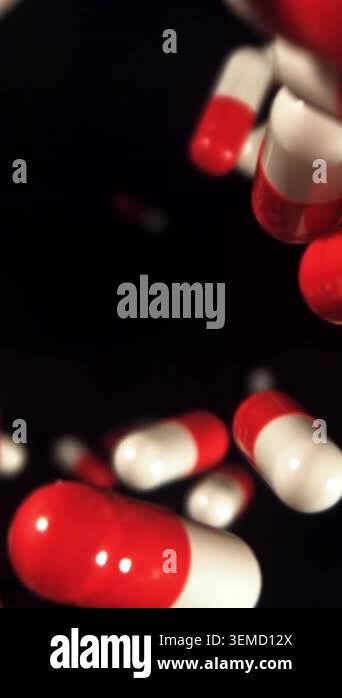 Red and white capsules tumble through black, urgent analgesic imagery ...