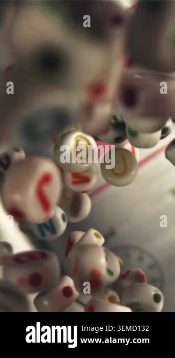 Falling letters on an open textbook. Filmed on a high-speed camera at ...