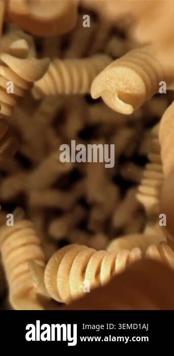 Fusili pasta falls down. Filmed on a high-speed camera at 1000 fps ...