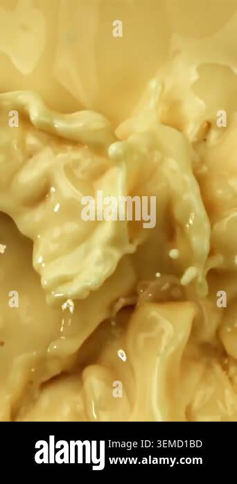 Super slow motion white chocolate splashes . Filmed on a high-speed ...