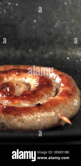 Sausages are grilled. Filmed on a high-speed camera at 1000 fps. High ...