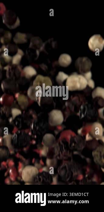 Peppercorns fly up and fall down. Filmed on a high-speed camera at 1000 ...