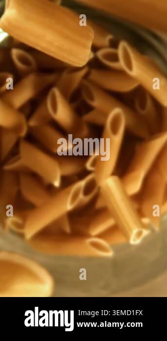 Super slow motion dry penne pasta . Filmed on a high-speed camera at ...