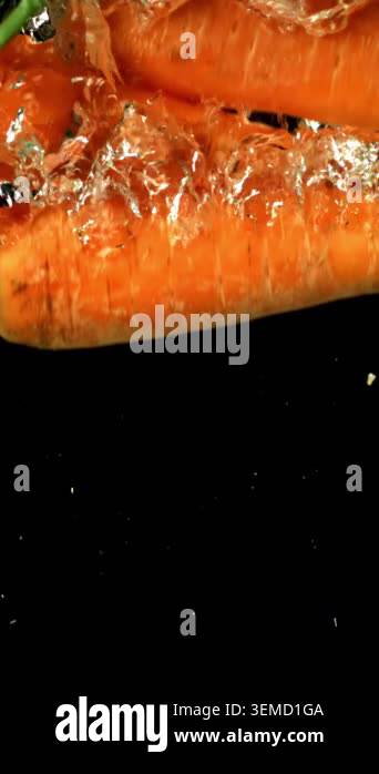 Super slow motion fresh carrots . Filmed on a high-speed camera at 1000 ...