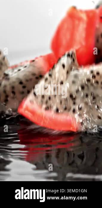 Super slow motion pieces dragon fruit . Filmed on a high-speed camera ...