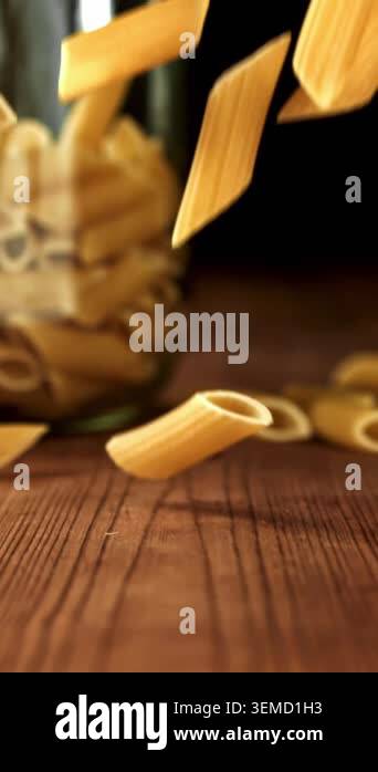 Super slow motion dry penne pasta . Filmed on a high-speed camera at ...