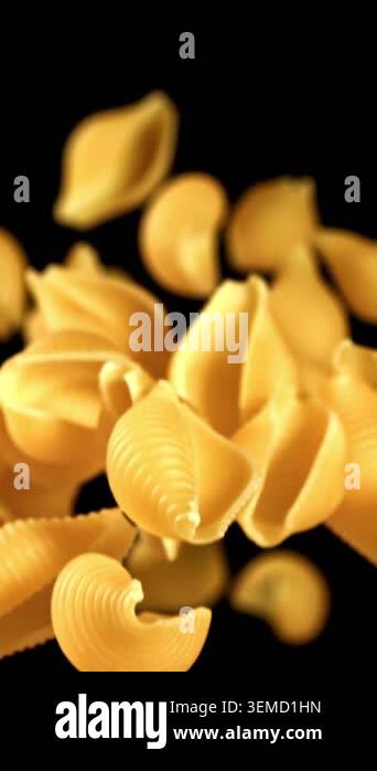 Super slow motion flying dry conchiglie pasta .Filmed on a high-speed ...