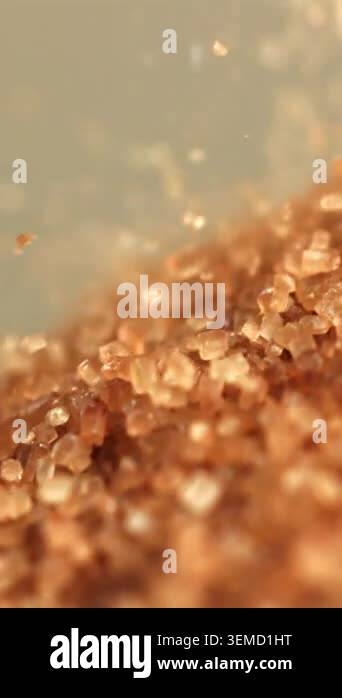 Cane sugar falls into a heap. Filmed on a high-speed camera at 1000 fps ...