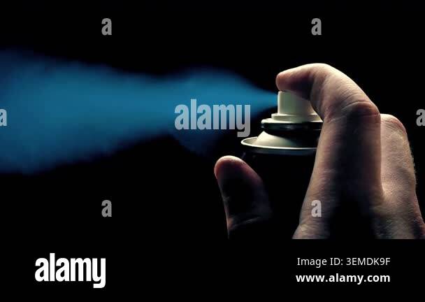 Blue Spraypaint Sprayed In Dark Area Stock Video Footage - Alamy