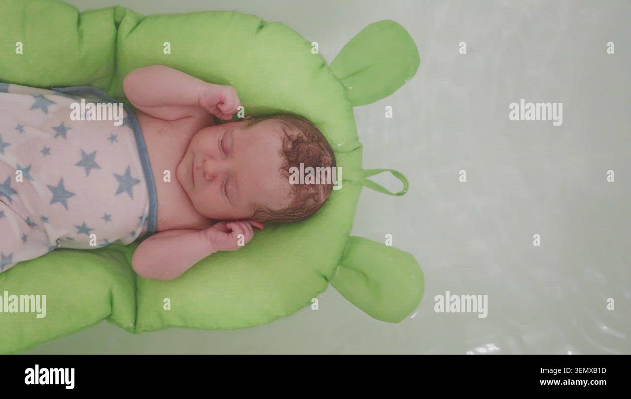 Newborn Baby Sleeping On Floating Support In Bathtub Stock Video ...