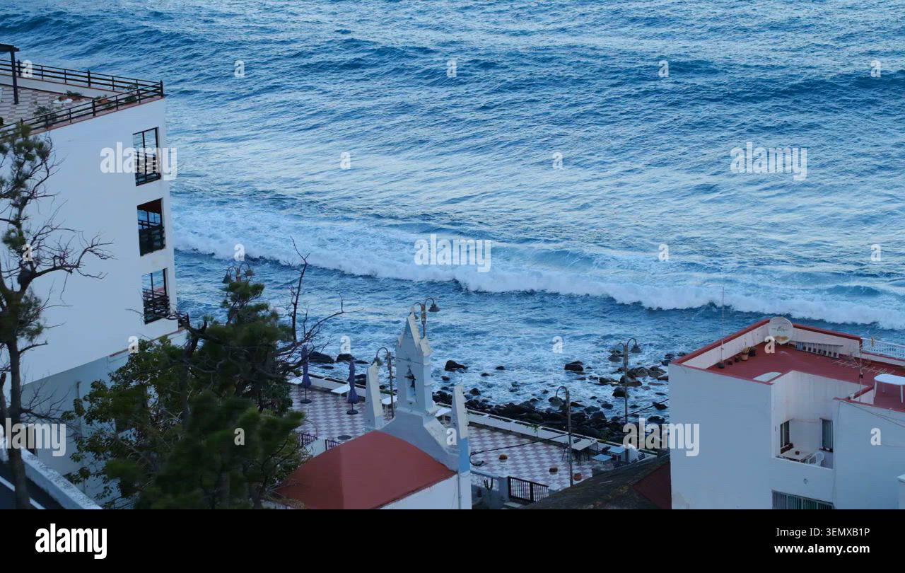 Slow-motion waves reaching the shore on a beautiful blue sea Stock ...