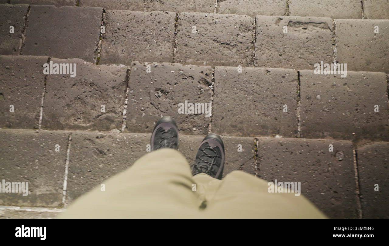Backpacker walking up ancient Wall stairs Stock Video Footage - Alamy