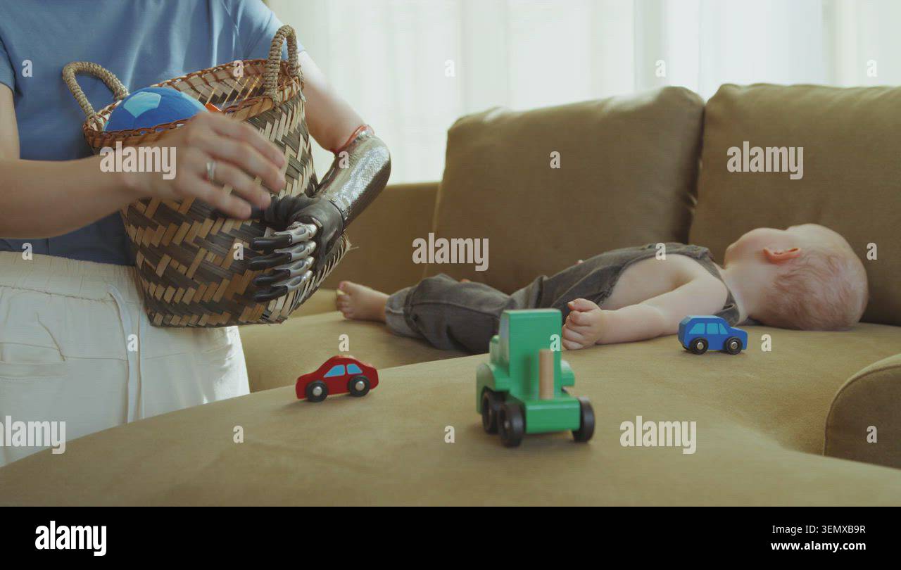Mother Tidying Toys Beside Sleeping Son Stock Video Footage - Alamy