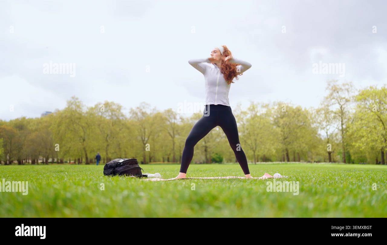 Woman exercising outdoors in park Stock Video Footage - Alamy