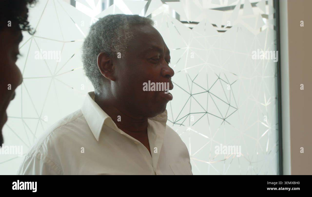 Senior businessman talks with his colleagues Stock Video Footage - Alamy