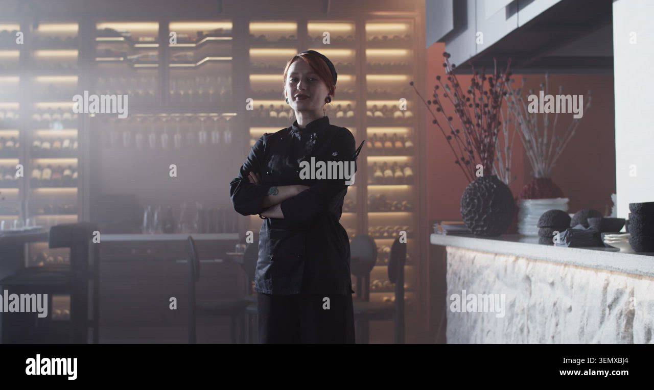 White woman chef stands in kitchen Stock Video Footage - Alamy