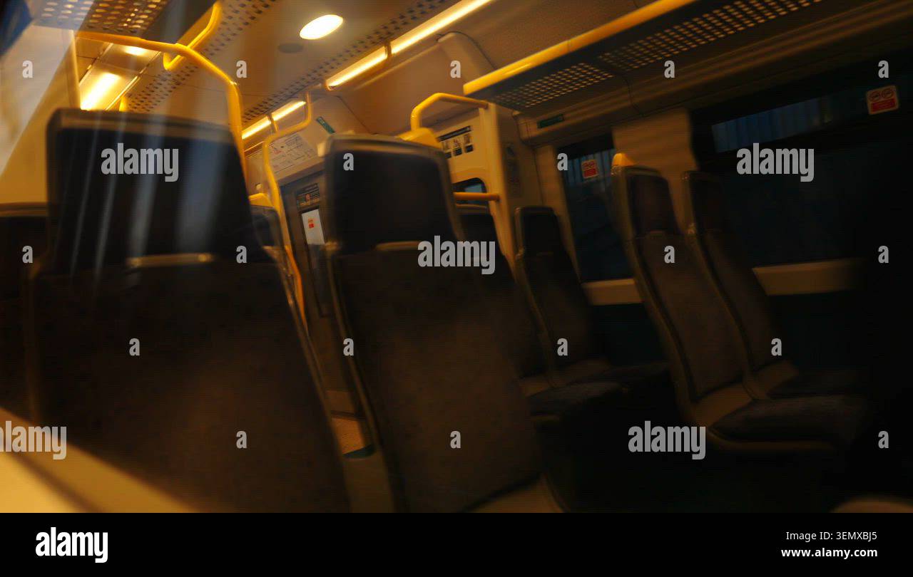 Train interior at night with empty seats Stock Video Footage - Alamy