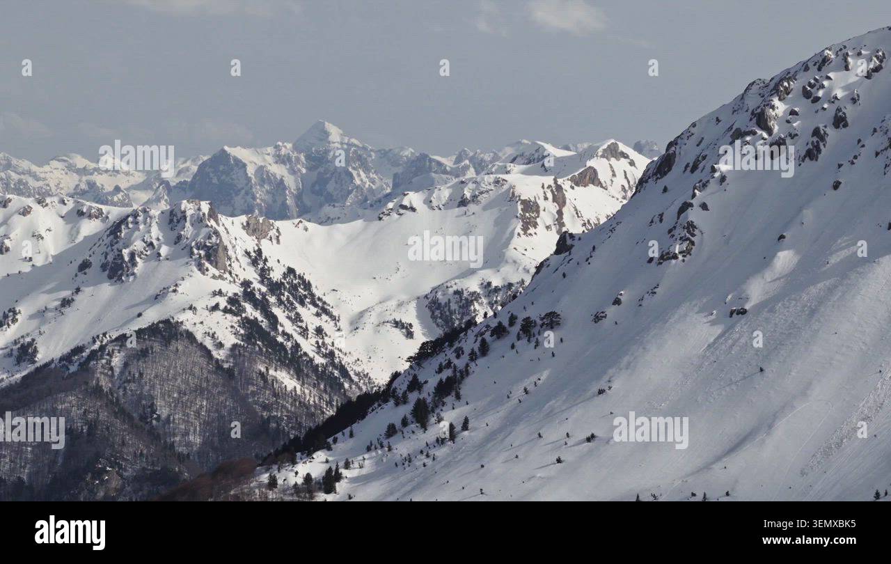 Snowy Mountain Peaks and Valleys in Winter Time, drone parallax Stock ...