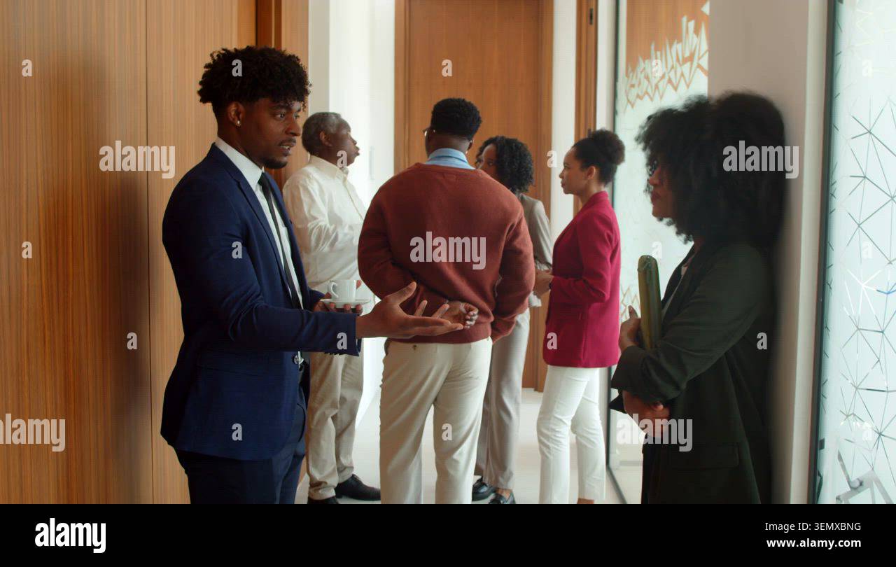 Group of People Talking in an Office Hallway Stock Video Footage - Alamy