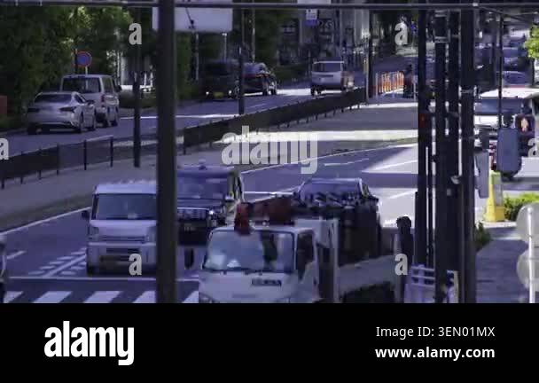 A timelapse of traffic jam at the city street in Shinjuku Tokyo. High ...