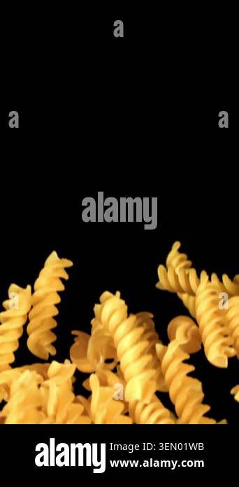 Super slow motion flying fusilli pasta dry . Filmed on a high-speed ...