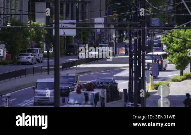 A timelapse of traffic jam at the city street in Shinjuku Tokyo. High ...