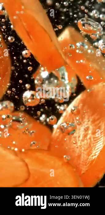 Super slow motion carrot slices. Filmed on a high-speed camera at 1000 ...
