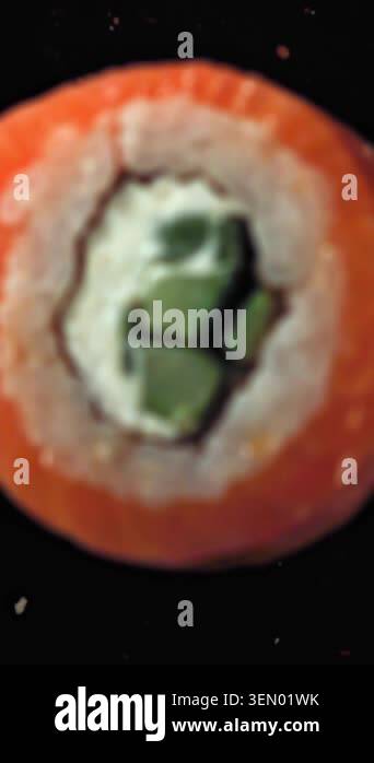 The Japanese roll falls into the soy sauce. Filmed on a high-speed ...