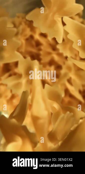 Super slow motion dry farfalle pasta . Filmed on a high-speed camera at ...