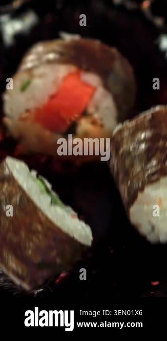 Japanese rolls fall into soy sauce. Filmed on a high-speed camera at ...