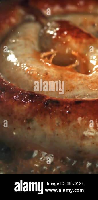 Sausages are grilled. Filmed on a high-speed camera at 1000 fps. High ...