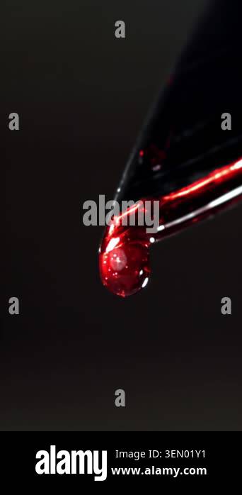 Blood dripping from the knife blade. Filmed on a high-speed camera at ...