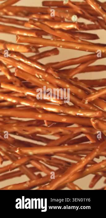 Salted cracker sticks fly and fall. Filmed on a high-speed camera at ...