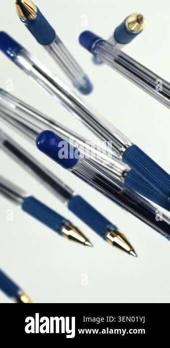 School pens fly up and down. Filmed on a high-speed camera at 1000 fps ...