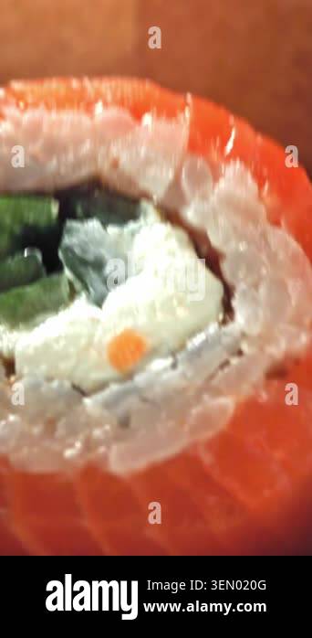 The Japanese roll falls into the soy sauce. Filmed on a high-speed ...