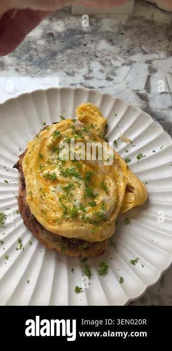 Cheerful asian female cooks delicious morning breakfast egg toast at ...