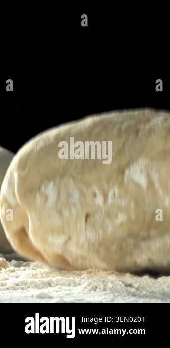 The dough falls on the table. Filmed on a high-speed camera at 1000 fps ...