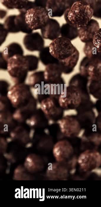 Chocolate corn balls fly up and down. Filmed on a high-speed camera at ...