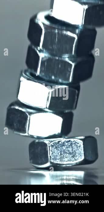 Nuts fall on a metal surface. Filmed on a high-speed camera at 1000 fps ...
