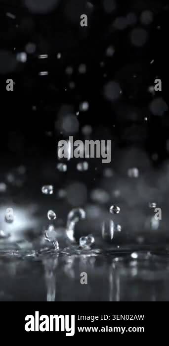 Super slow motion falling raindrops . Filmed on a high-speed camera at ...