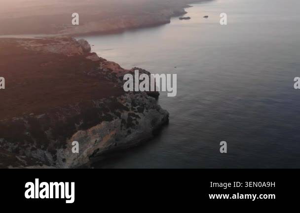 Aerial Cliff Coastline Sunset Calm Waters, Drone Sweeping Over Rocky ...