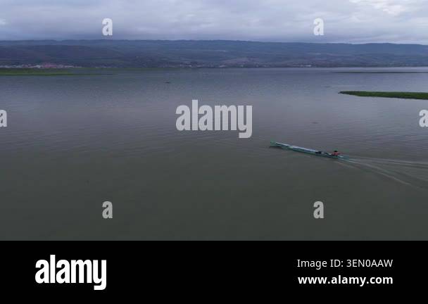Aerial View of Boat Sailing on a Calm Lake Stock Video Footage - Alamy