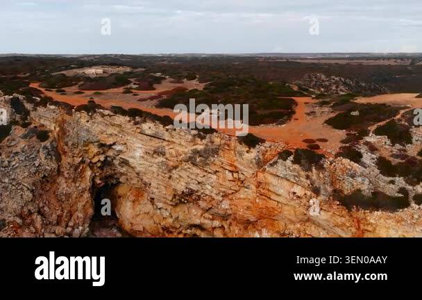 Aerial Rugged Red Cliff Coastline With Ochre Soil And Exposed Limestone ...