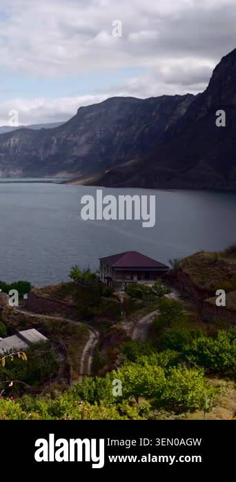 Mountain Inlet Village Framed By Rugged Peaks, Tranquil Water ...