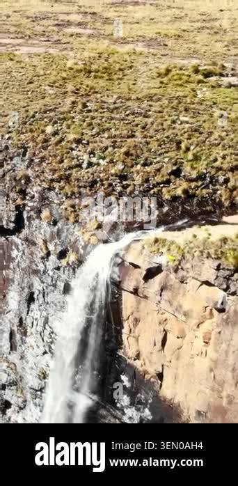 Aerial Drone Footage Waterfall Cliff Edge On Windswept Plateau With ...