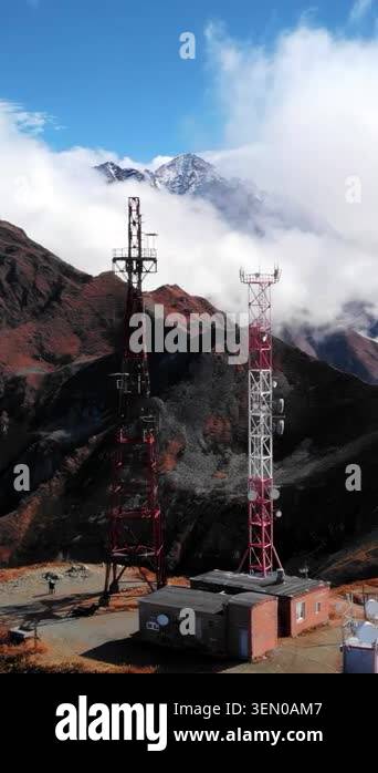 Communications Tower On Cloud Capped Ridge, Rustic Equipment Huts And ...