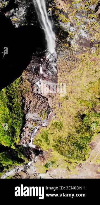 Aerial Waterfall Cascading Through Mossy Canyon, Drone Reveals Narrow ...