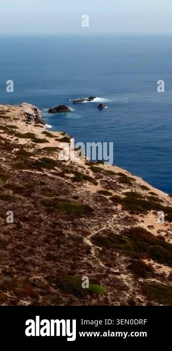 Aerial Cliff Coastline With Ocean And Rugged Headland, Parked Cars ...